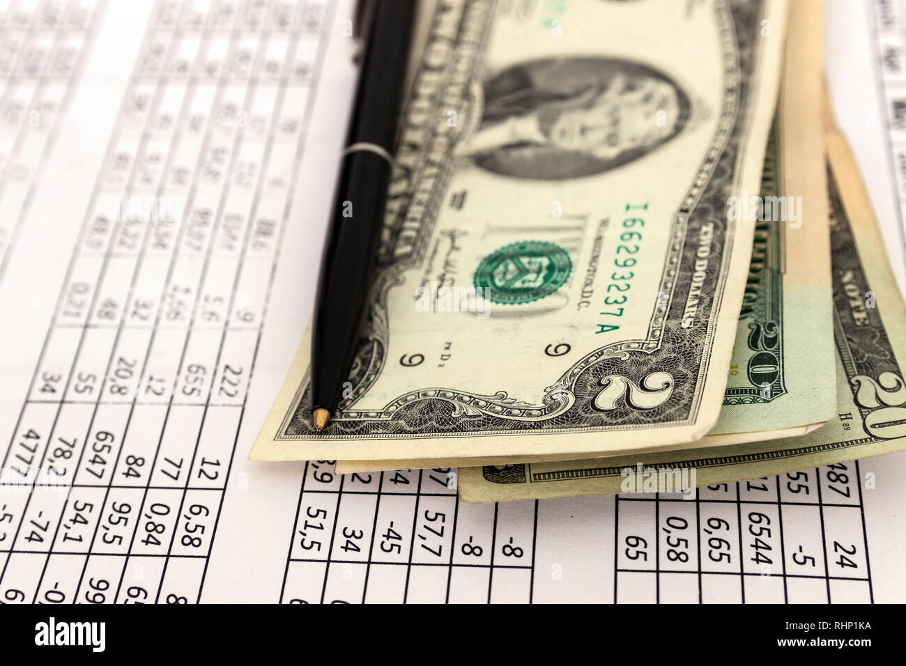 Money and pen, piece of paper with numbers, business concept. American ...