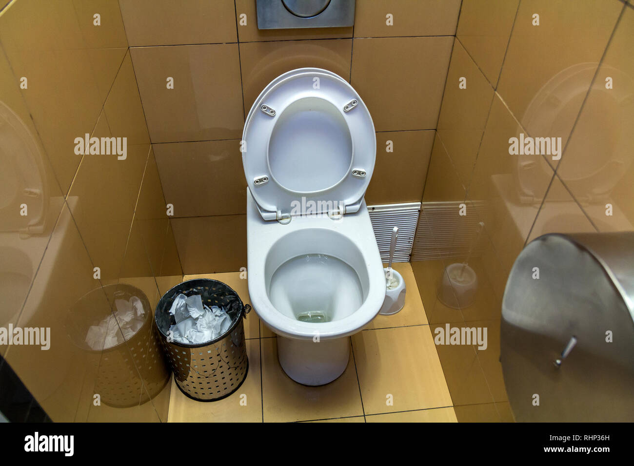 Interior of simple restroom toilet, view from above. White ceramic ...