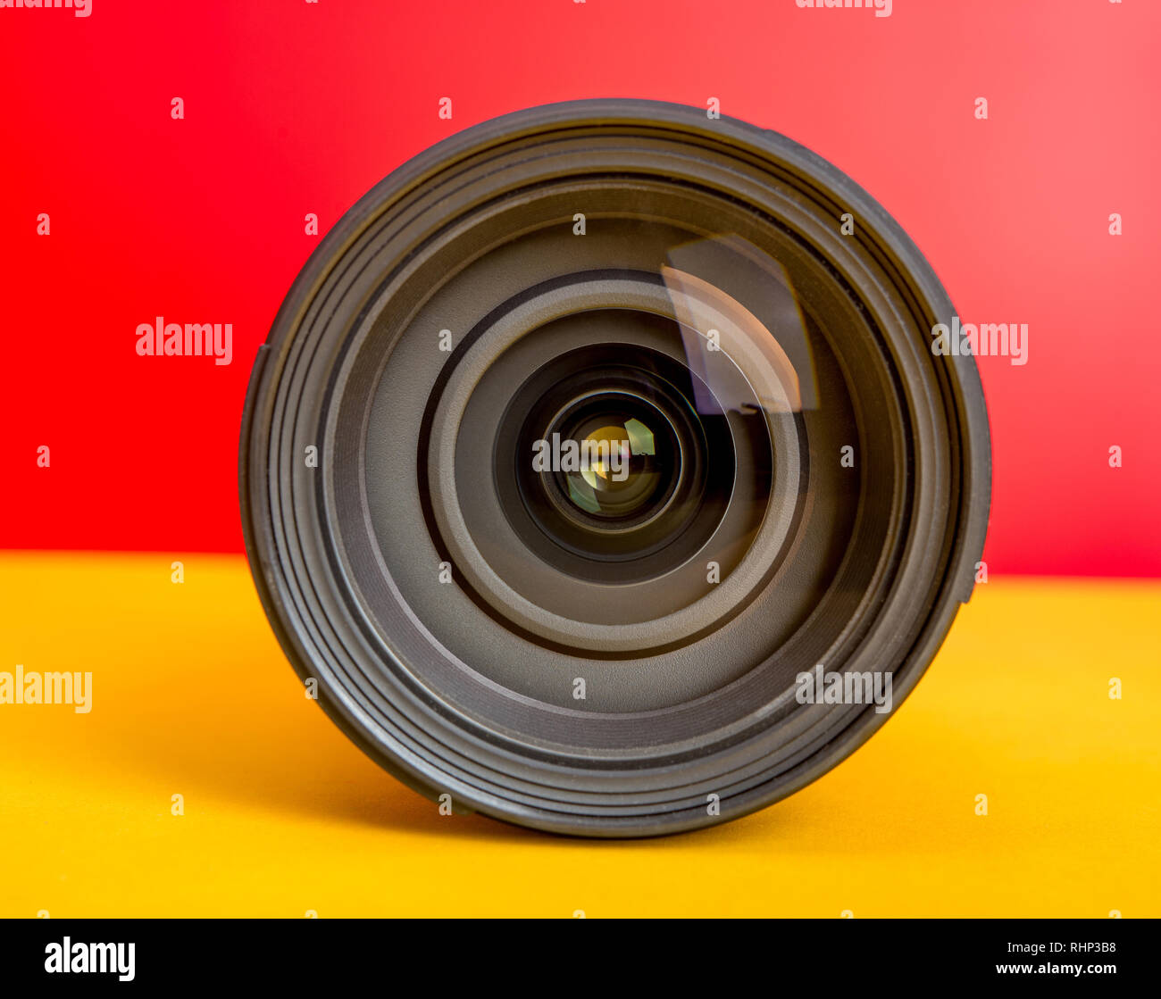 Professional Camera Lens on red and yellow background template Stock ...