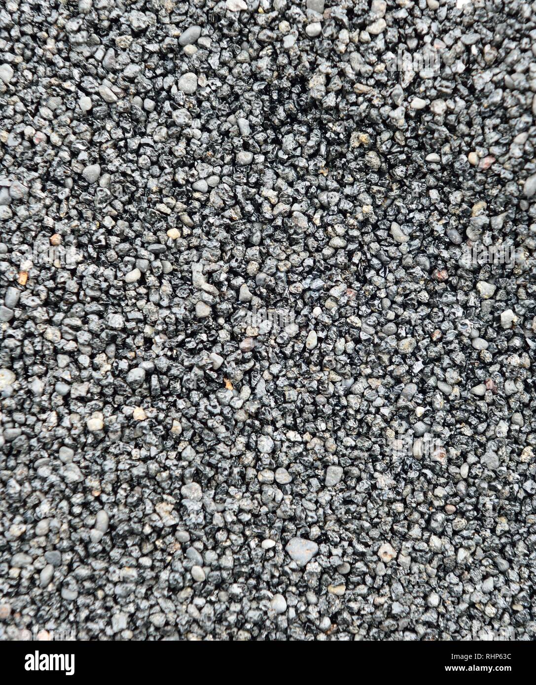 wallpaper with a closeup of black volcanic sand in Hawaii Big Island ...