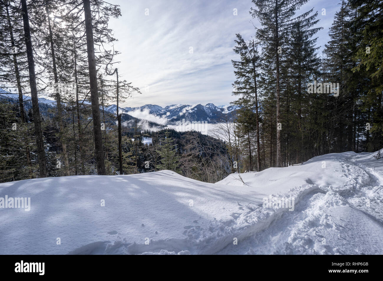 Fog is raising in an alpine panorama Stock Photo - Alamy