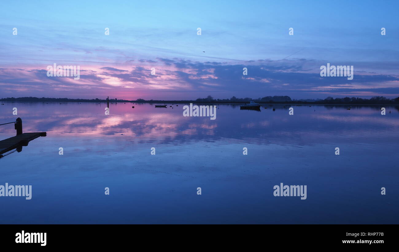 sunset stages at bossom harbour Stock Photo - Alamy