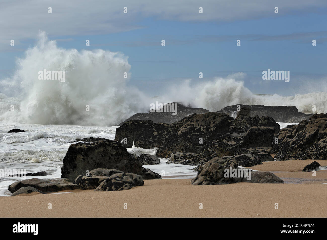 Big sea wave splash in a rocky sunny beach Stock Photo - Alamy