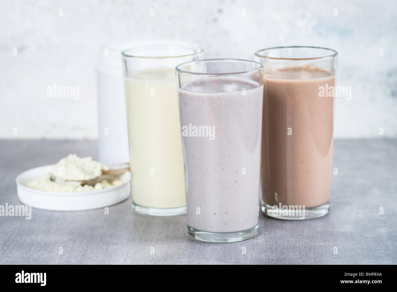 Protein cocktails. Vanilla, berry and chocolate protein shakes. Sports ...