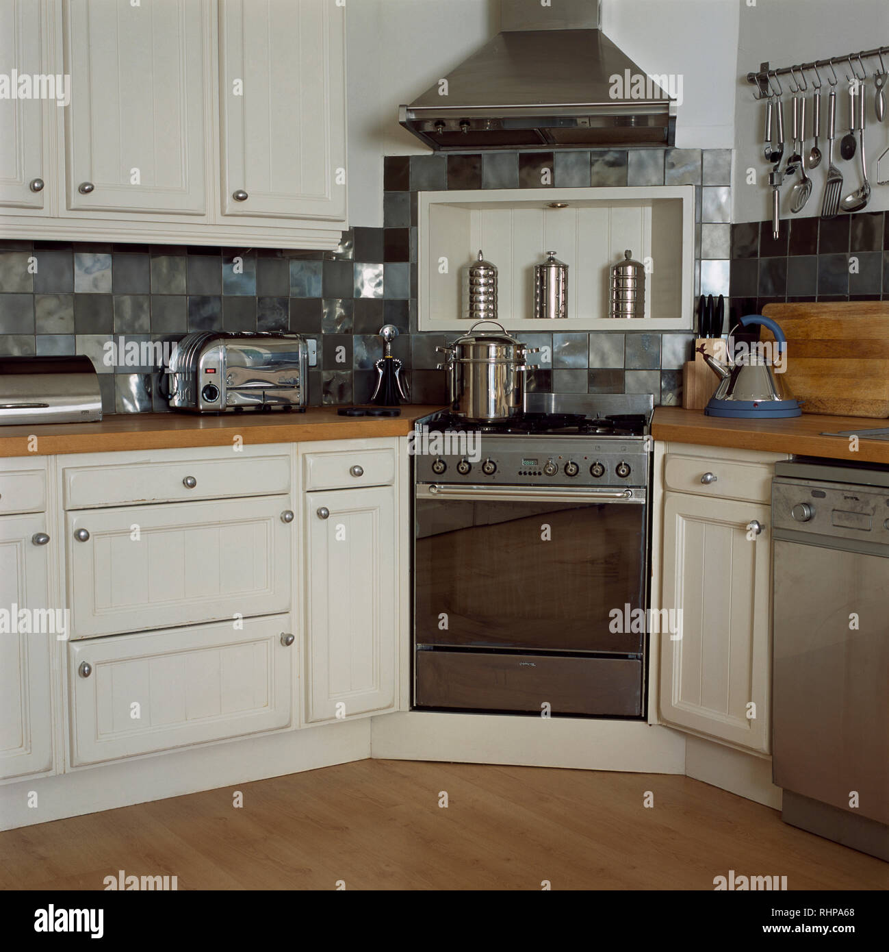 Stainless steel extractor and oven in modern kitchen Stock Photo - Alamy