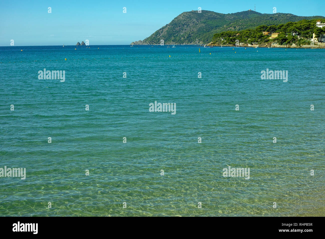 Sunny sandy beach vacation, landscape with clear blue sea shore and ...