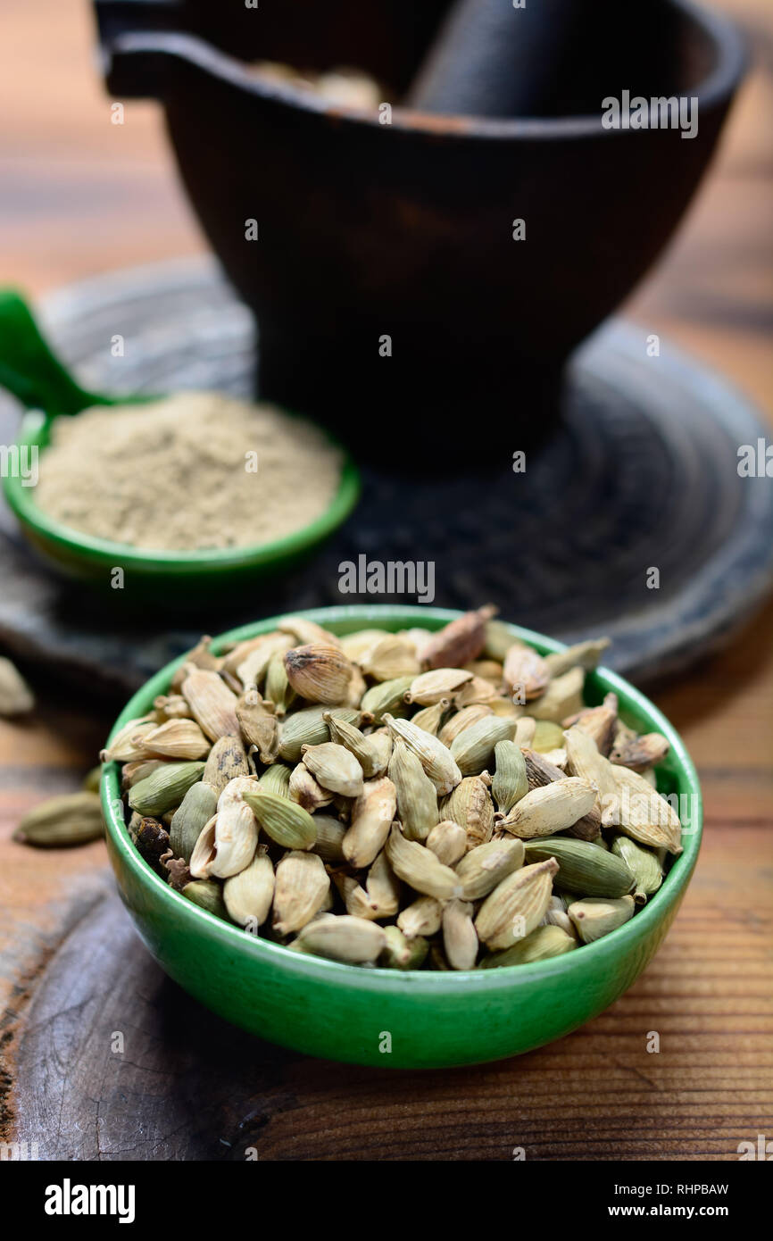 Bowl with cardamom pots and cardamom powder, used for cooking and ...