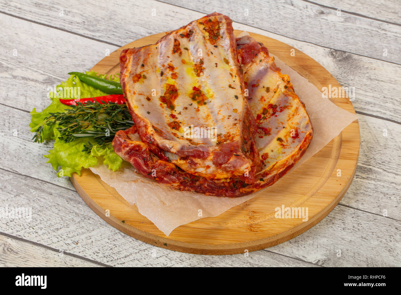 Marinated Raw pork ribs for grill Stock Photo - Alamy