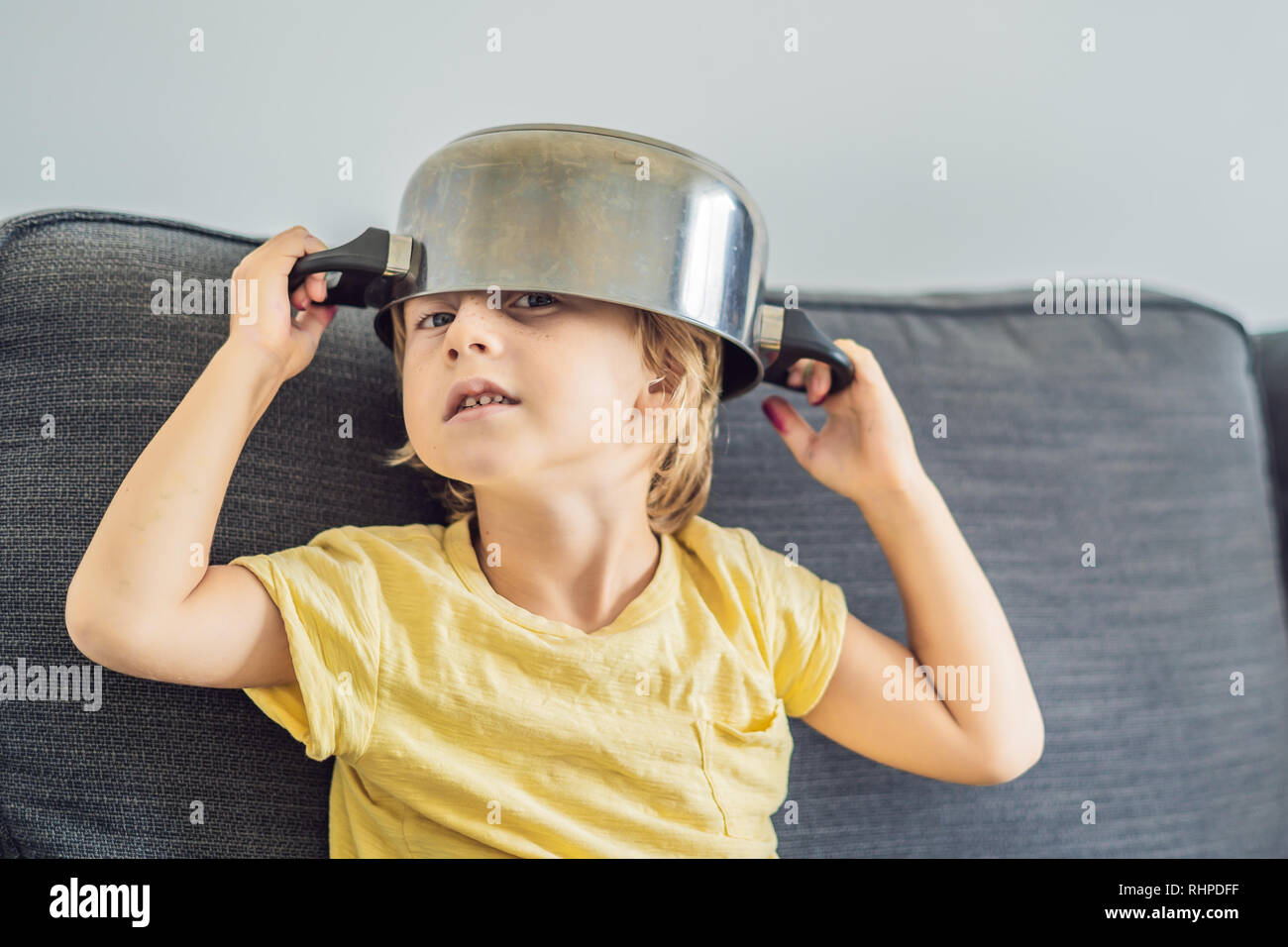 A boy with a pot on his head. Childhood, cook Stock Photo - Alamy