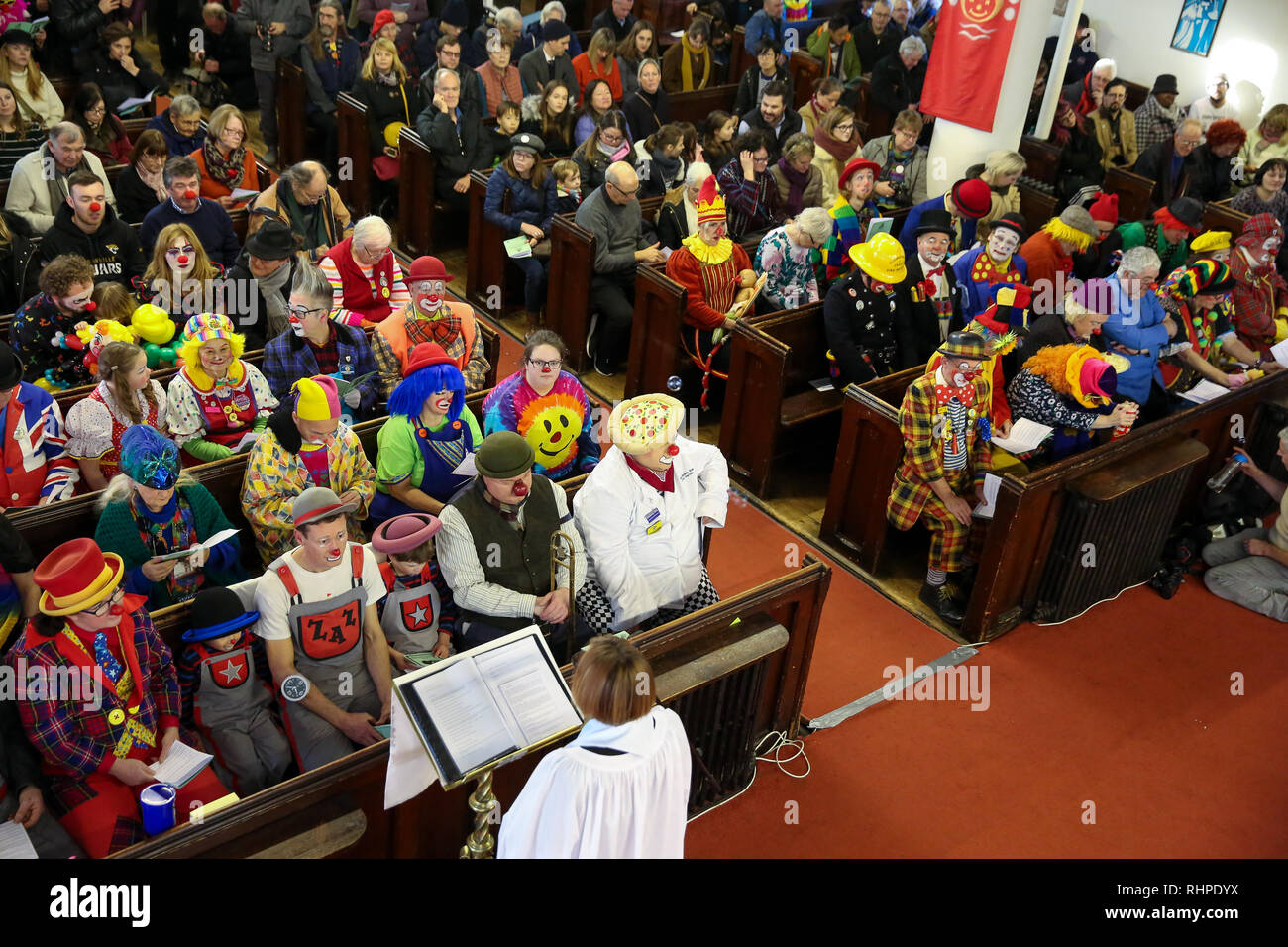 Clowns are seen attending a church service at All Saints Church ...