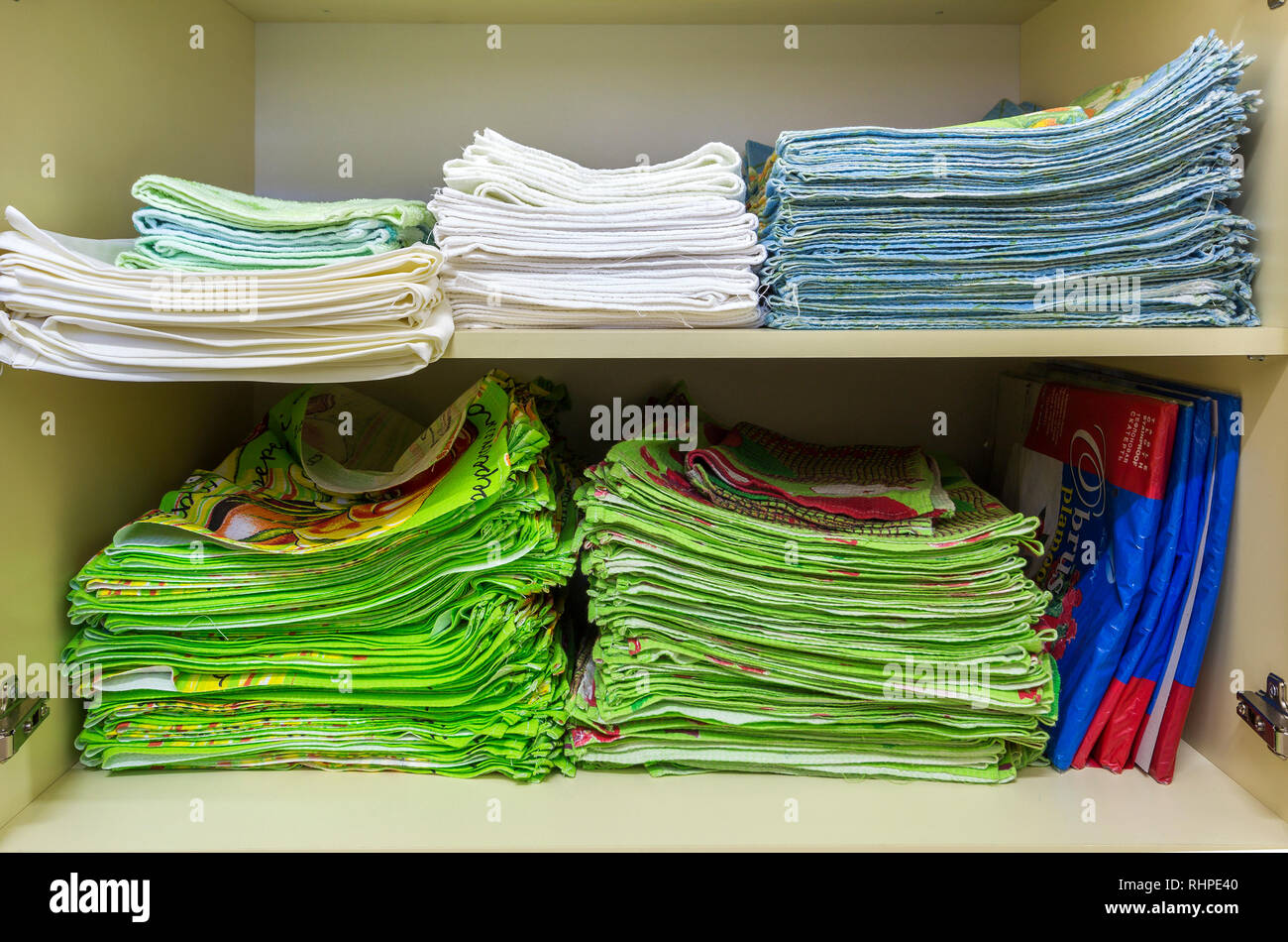 Interior of white plastic cabinet or clothing wardrobe with open doors ...