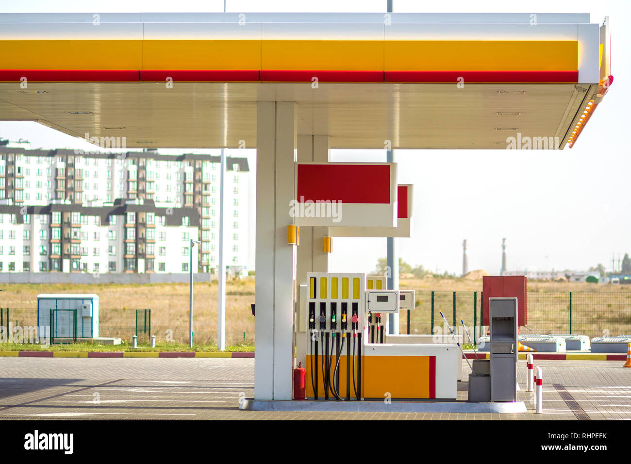 Clean empty auto gas station exterior on sunny day on rural landscape ...