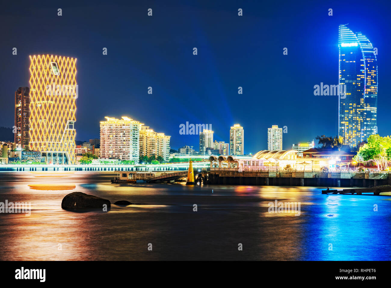 XIAMEN, CHINA -OCTOBER 11: This is a night view of city skyline ...