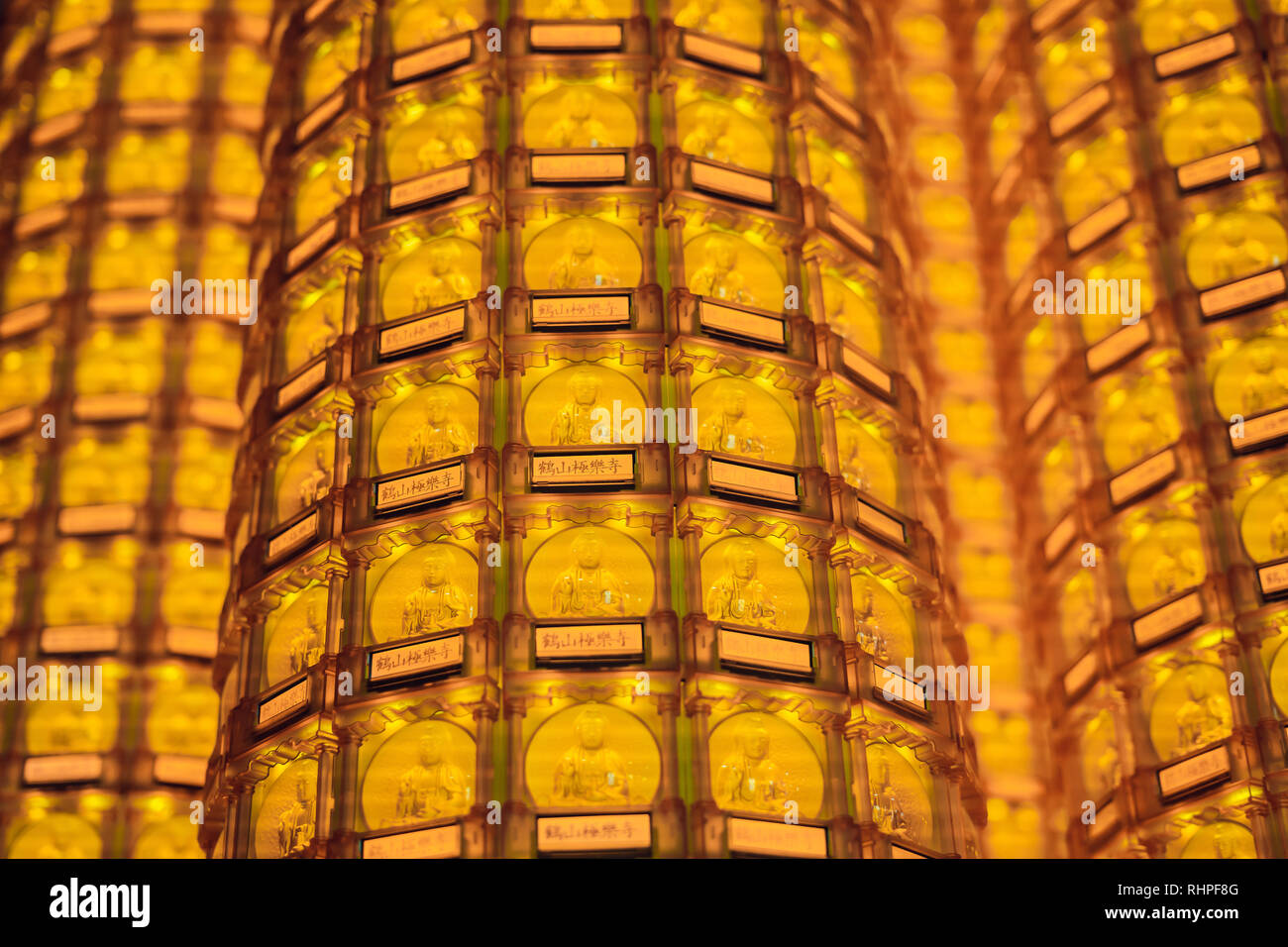 The wall in the temple is filled with buddhas. Religion Buddhism ...
