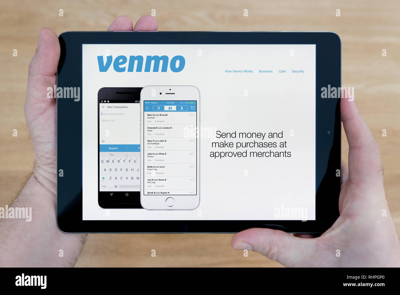 A man looks at the Venmo website on his iPad tablet device, shot ...