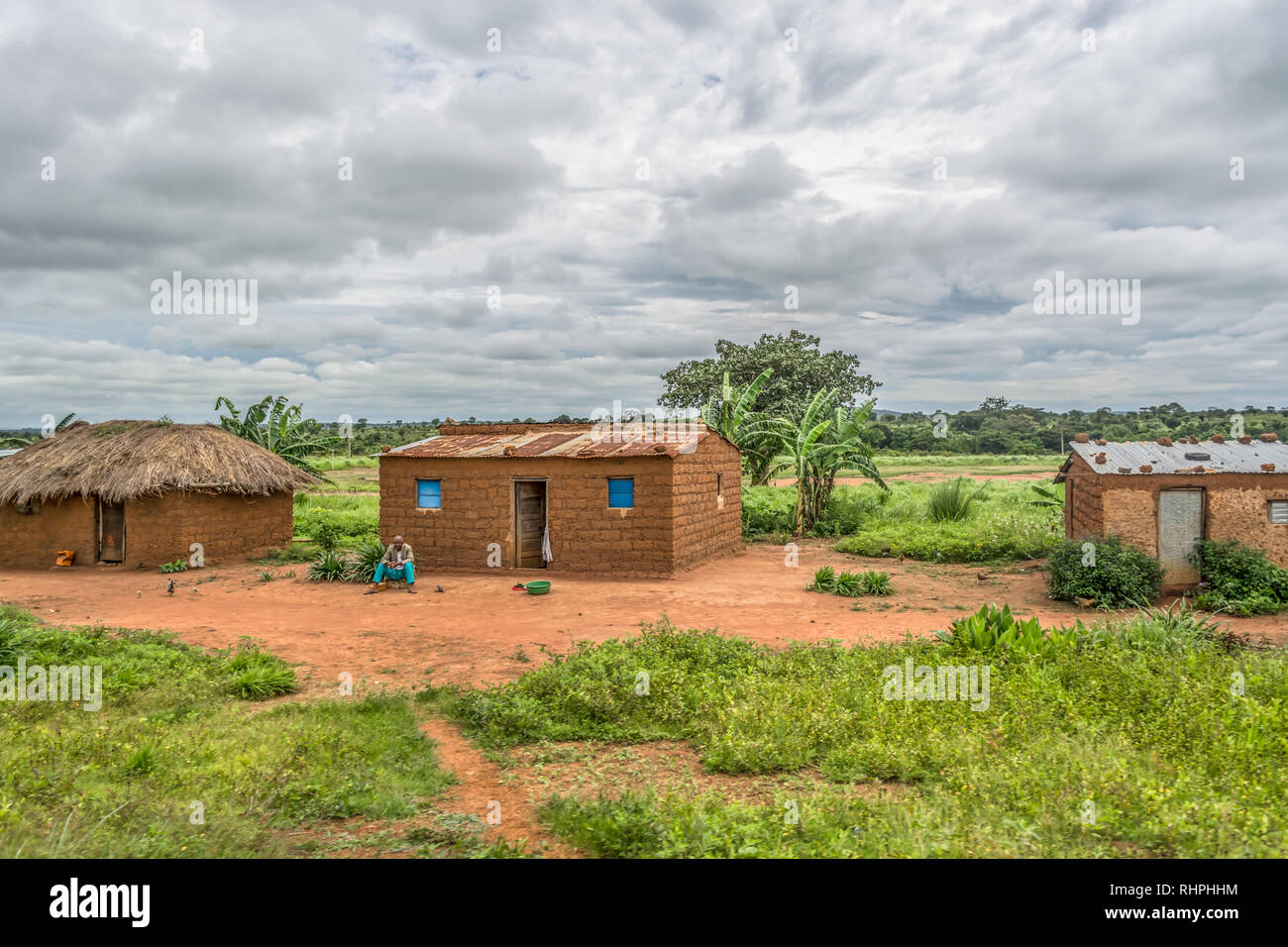 Malange / Angola - 12 08 2018: View of traditional village, old man ...