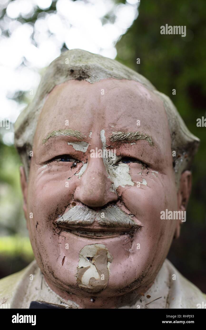 A decaying old statue of Colonel Sanders Stock Photo - Alamy