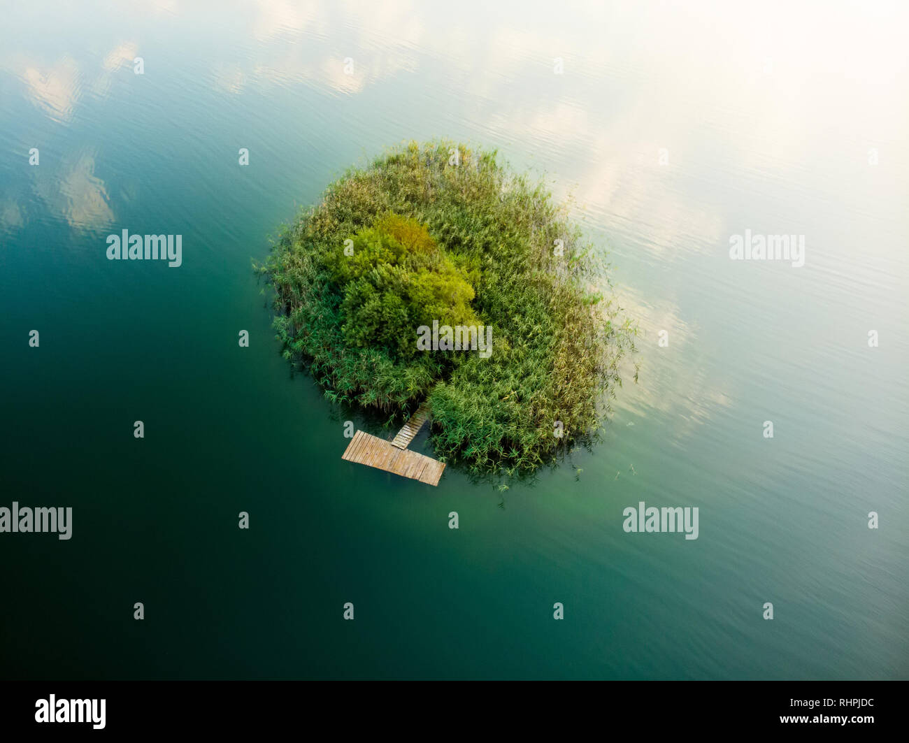Aerial top down view of small island. Birds eye view of beautiful green ...