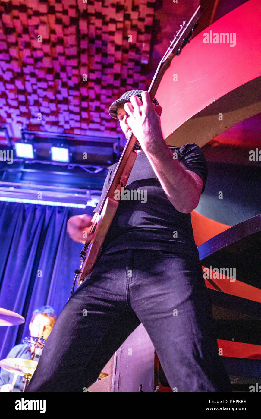 Bass guitarist, musician playing guitar on stage, concert Stock Photo ...