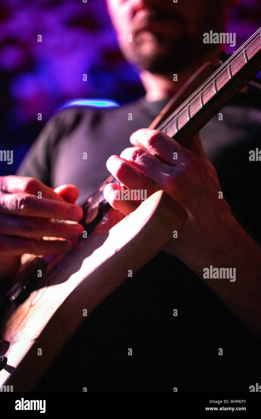 Bass guitarist, musician playing guitar on stage, concert Stock Photo ...