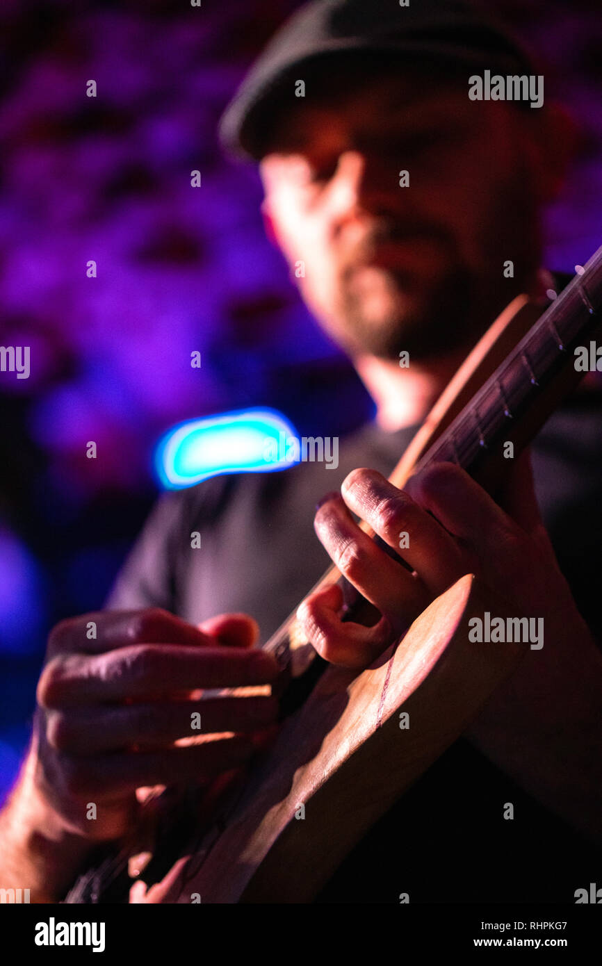 Bass guitarist, musician playing guitar on stage, concert Stock Photo ...