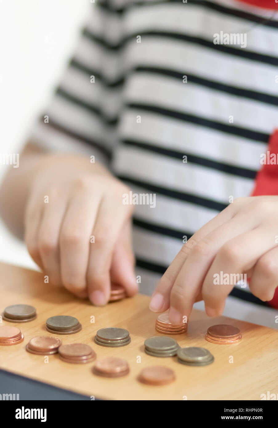 Coin stacking hi-res stock photography and images - Alamy