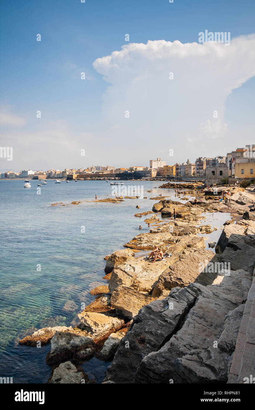 TRAPANI / SICILY - SEPTEMBER 11, 2011: People swimming and sunbathing ...