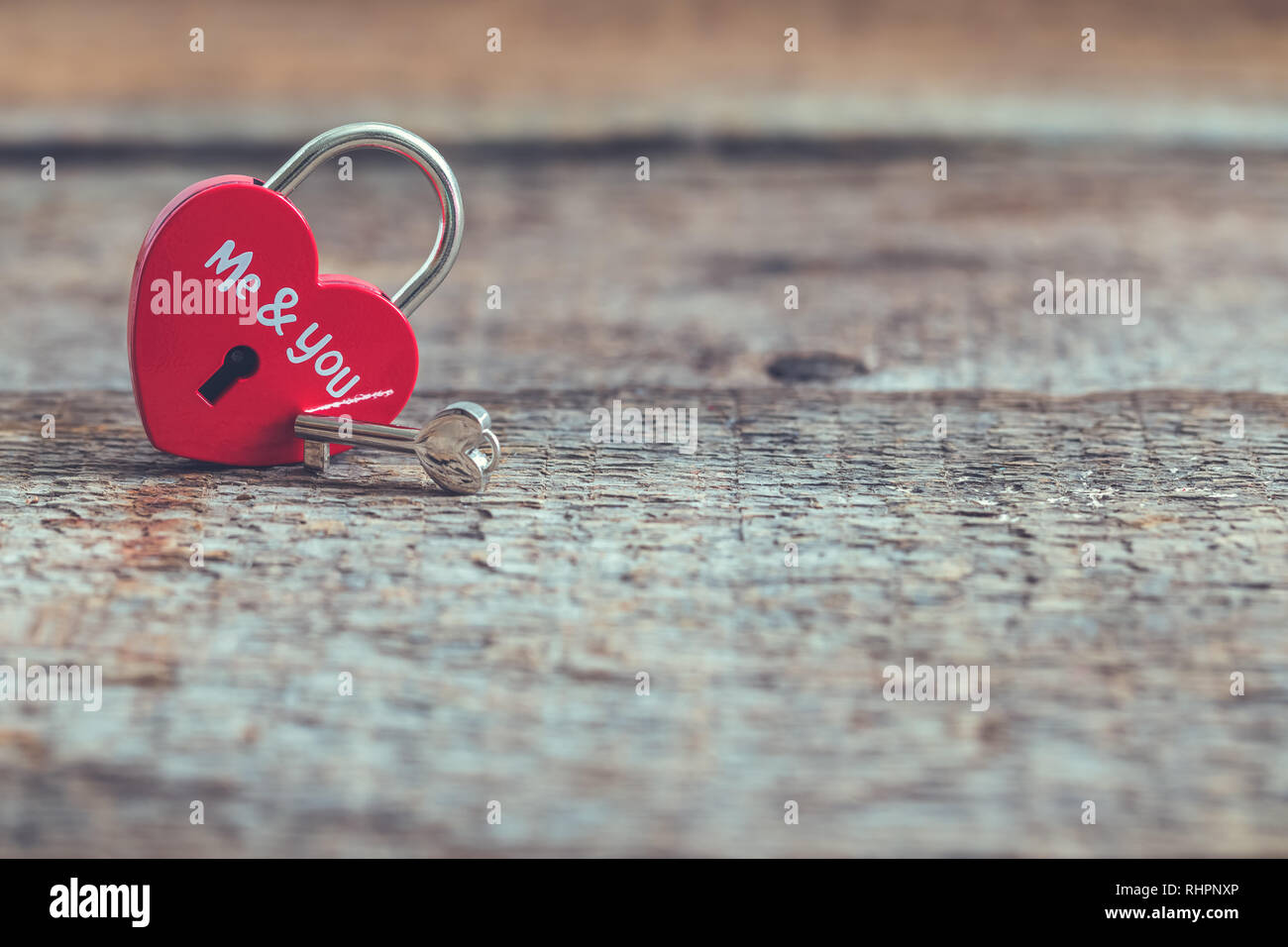 Red heart-shaped padlock with key on wooden background, St Valentine's ...