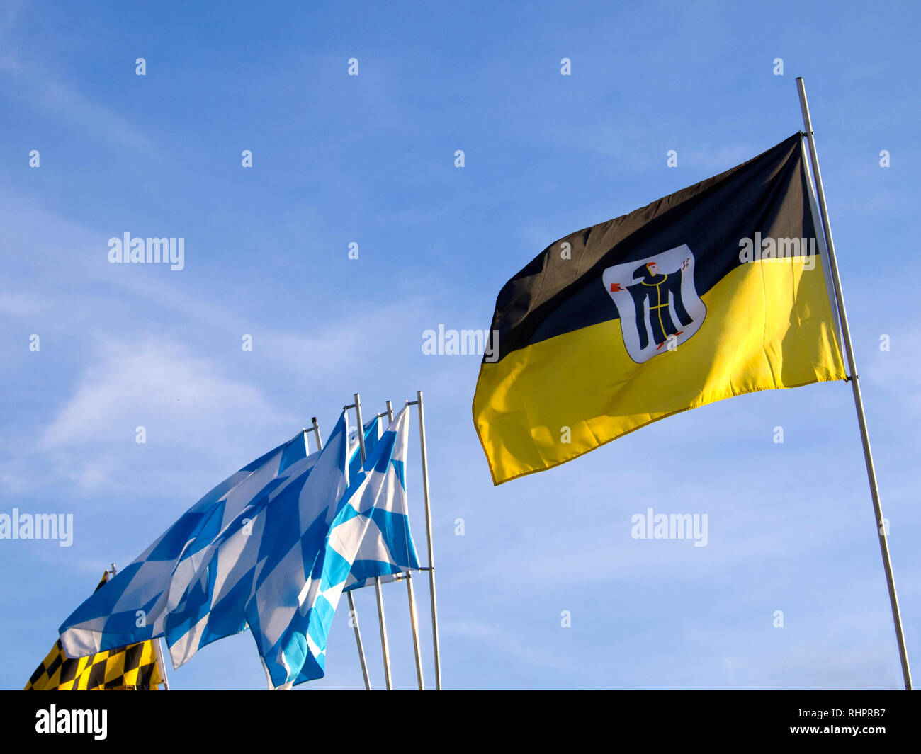 Bavarian flags with Munich flags in front of blue sky Stock Photo - Alamy