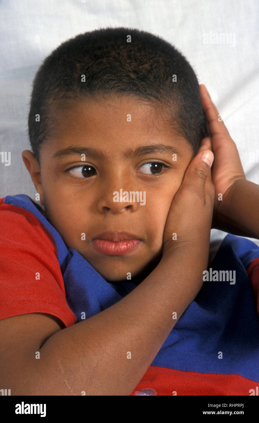 little black boy with earache or toothache Stock Photo - Alamy