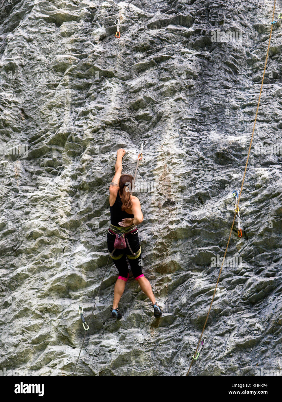 Engelberg, switzerland - july 29, 2017: climber on vertical rock face ...