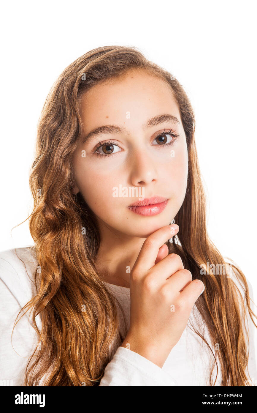 Beautiful young girl thinking or having an idea isolated on white ...