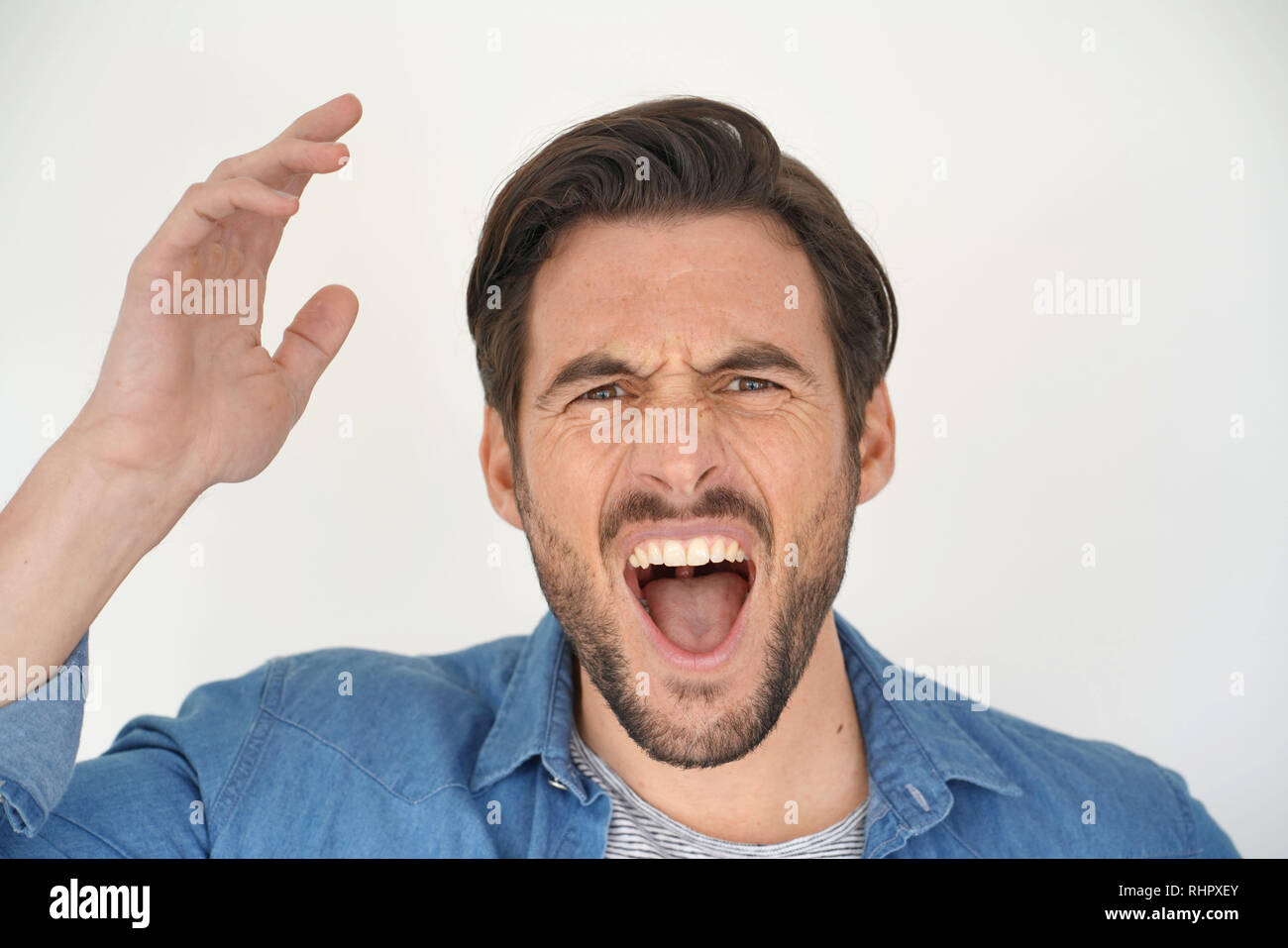 Portrait of handsome man shouting on white background Stock Photo - Alamy