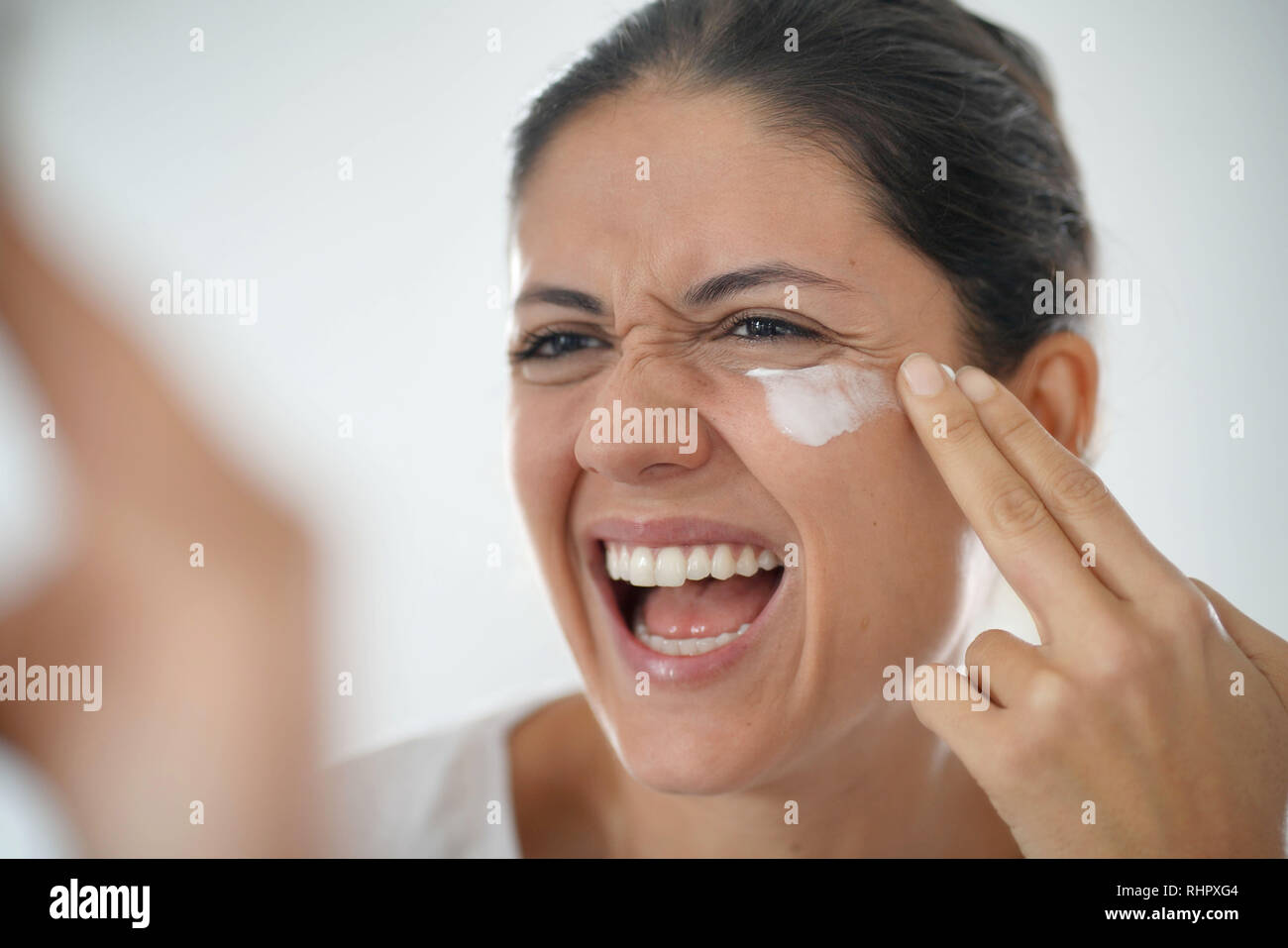 Beautiful brunette going through beauty routine Stock Photo - Alamy