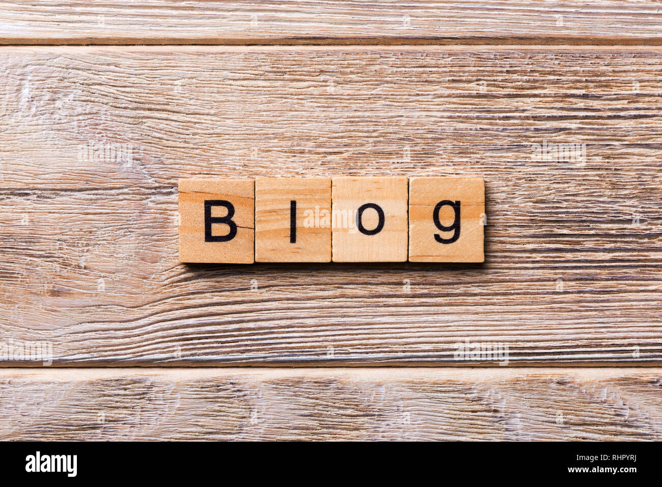 BLOG word written on wood block. BLOG text on wooden table for your ...