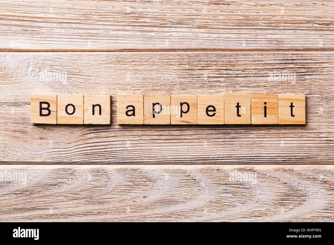 Bon Appetit word written on wood block. Bon Appetit text on wooden ...
