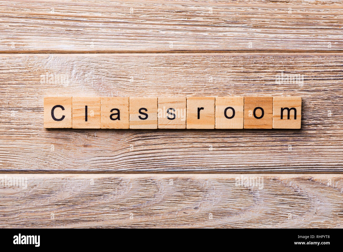 Classroom word written on wood block. Classroom text on wooden table ...