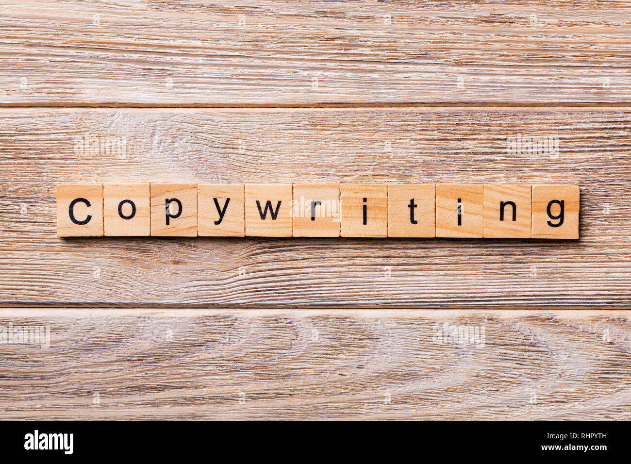 Copywriting word written on wood block. Copywriting text on wooden ...