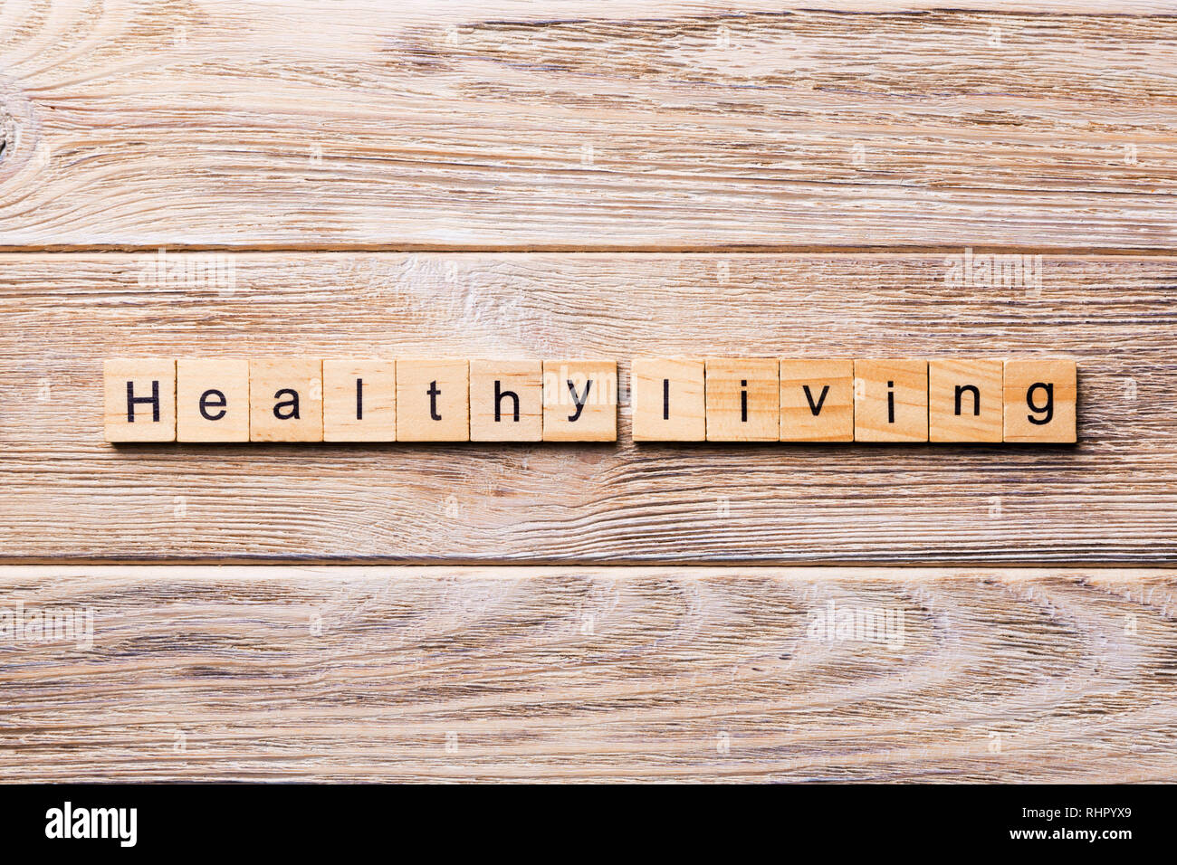Healthy Living word written on wood block. Healthy Living text on ...
