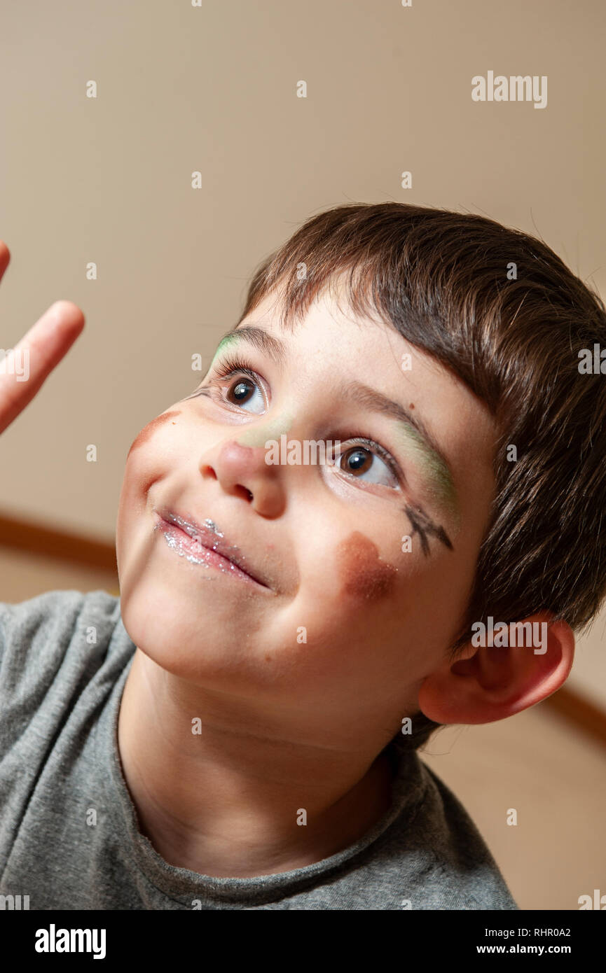 Young boy with face make-up Stock Photo - Alamy