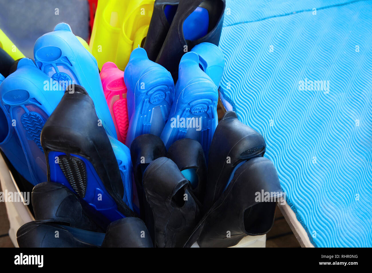 Colorful flippers in the box. Diving and snorkeling accessories Stock ...