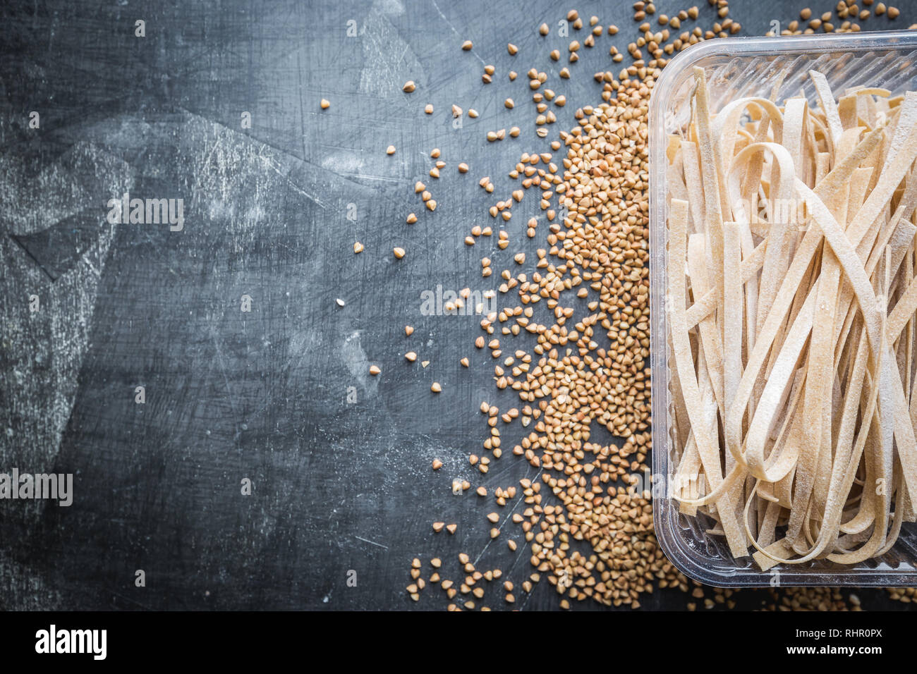 Homemade buckwheat noodles on black background, top view Stock Photo ...