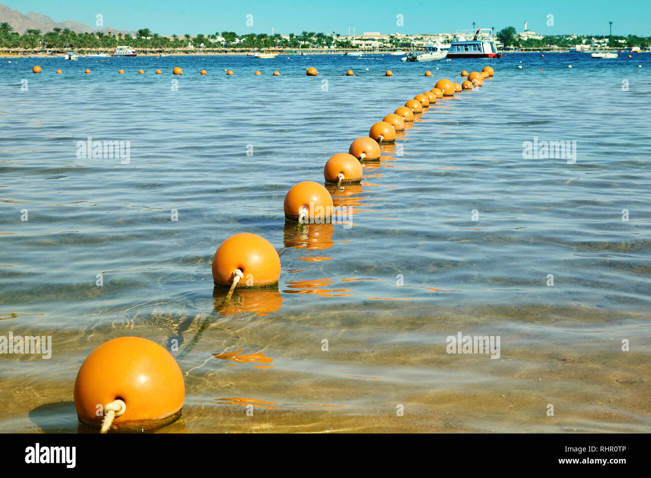 Buoys in the sea. View of the sea from a shore with a long line of ...