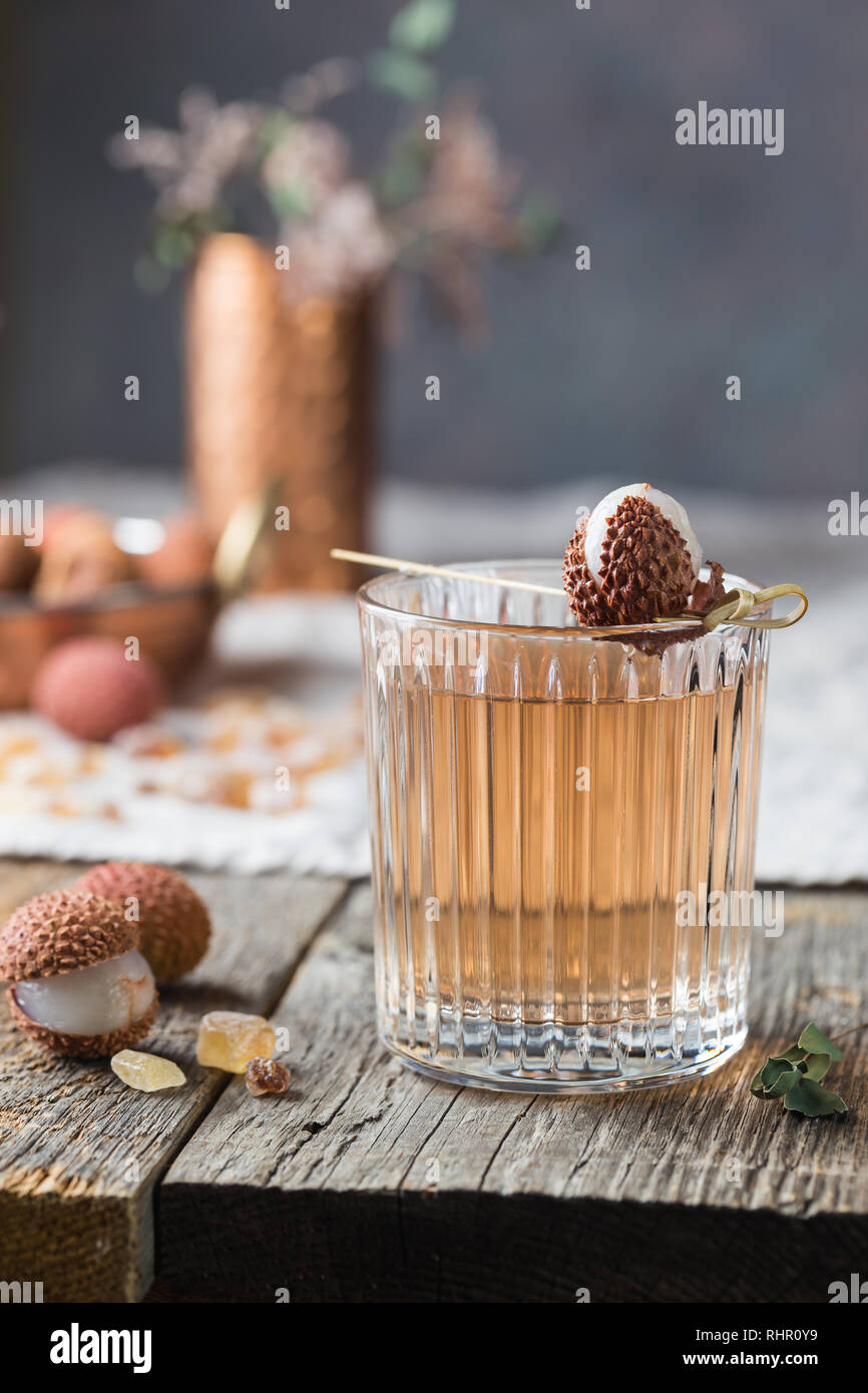 Glass of cold lychee juice on the old wooden table, rustic style Stock ...