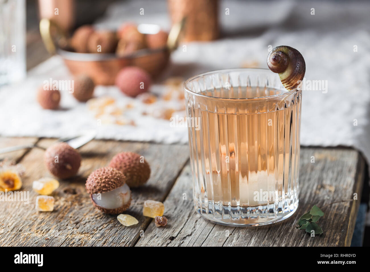 Glass of cold lychee juice on the old wooden table, rustic style Stock ...
