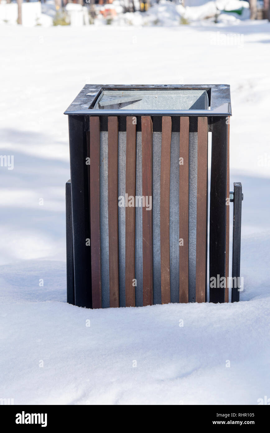 Bin for garbage in the snow Stock Photo - Alamy