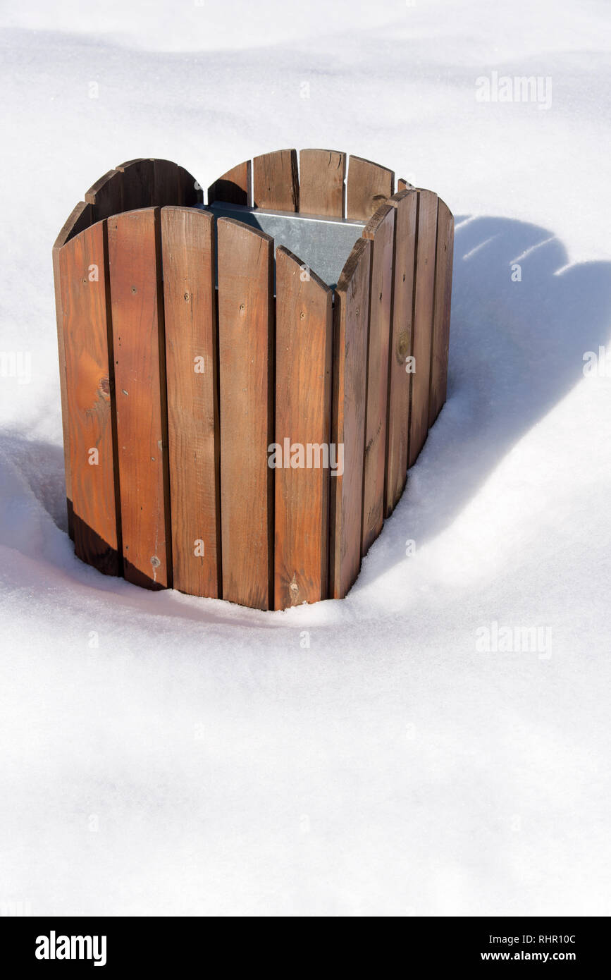 Bin for garbage in the snow Stock Photo - Alamy