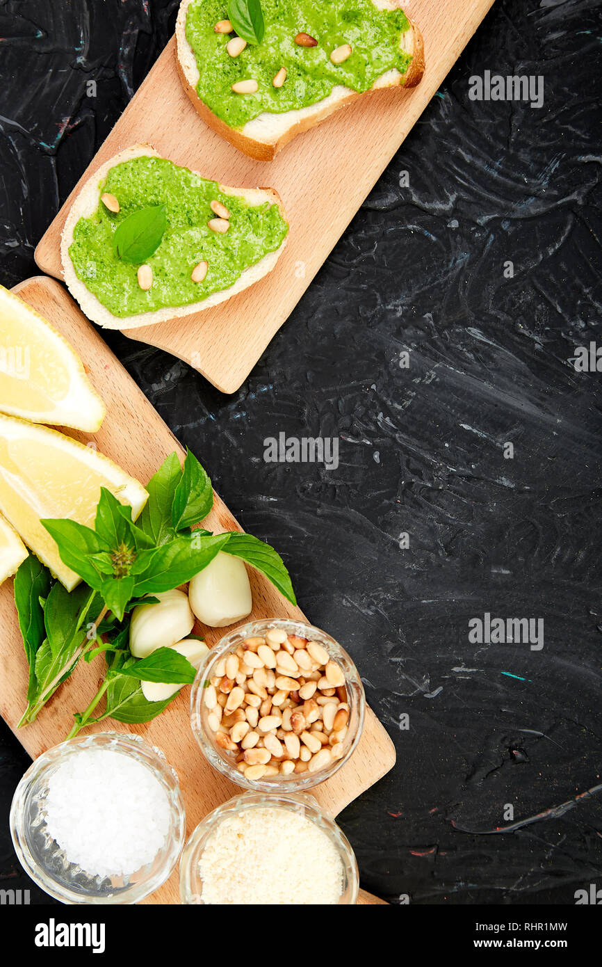 Bruschetta bread with pesto sauce, parmesan cheese and fresh basil ...