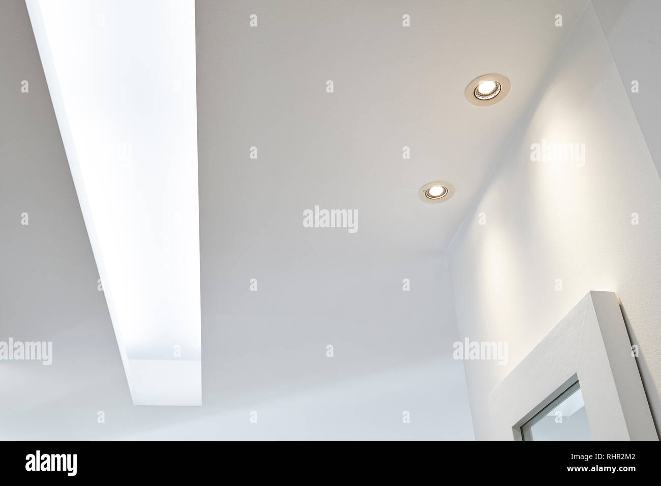 Two spot light illuminated on white ceiling Stock Photo - Alamy