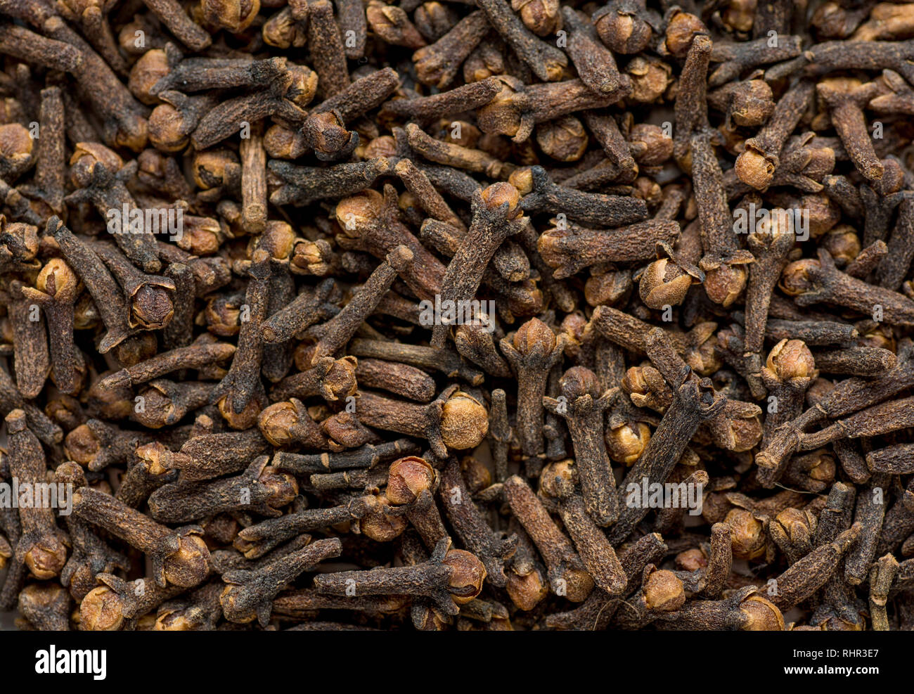 Freshly dryed clove spice texture close up. Top view Stock Photo - Alamy